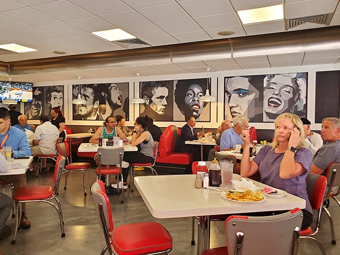 The dining room buzzes with conversation and clinking silverware—a symphony of satisfaction conducted under the gaze of silver screen legends.
