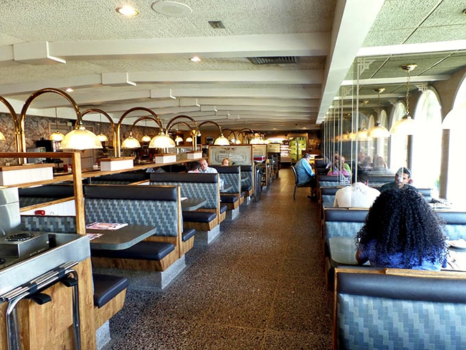 Another angle reveals the diner's perfect symmetry—where pendant lights create pools of golden illumination over booths that have witnessed countless first dates and family celebrations.