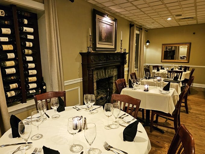 A fireplace that transforms dinner into an occasion, with wine bottles standing by like supporting actors in your evening's performance.