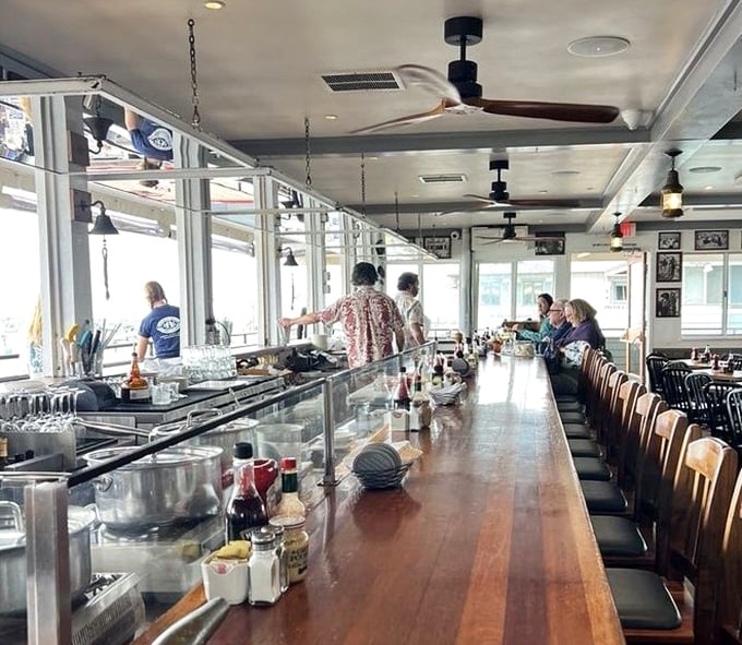 Where strangers become friends over cold beers and hot seafood. This bar has heard more fishing tales than a harbor master—some of them even true.