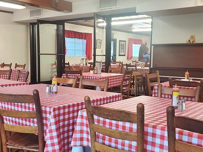 Red-checkered tablecloths and wooden chairs create the timeless backdrop for conversations that flow as easily as sweet tea.