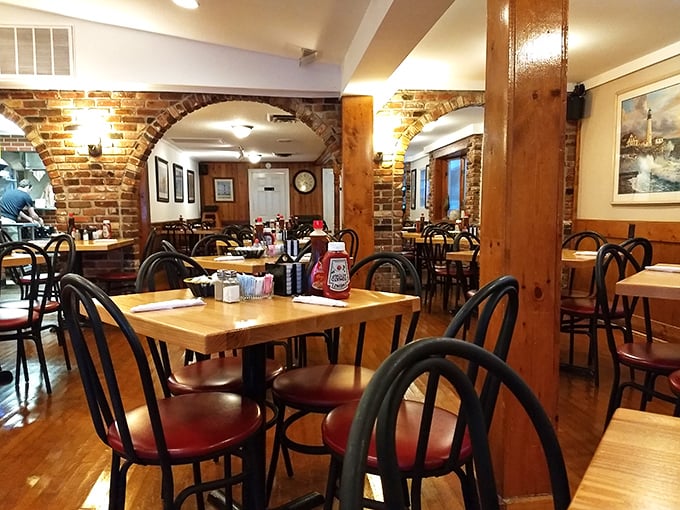 Brick archways and wooden tables create the kind of authentic diner atmosphere money can't buy – only decades of service can achieve this patina.