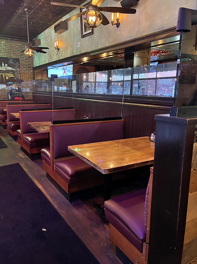 Burgundy booths invite you to settle in for the long haul. This isn't fast food—it's food worth lingering over.