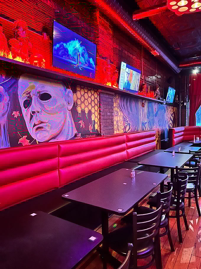 Where horror movie murals watch you eat, turning every meal into dinner theater without intermission.