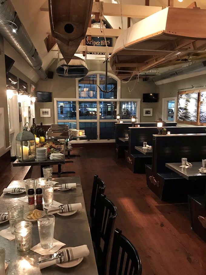Evening at Striper Bites transforms the dining room into a warm, nautical sanctuary where every table feels like the captain's table.