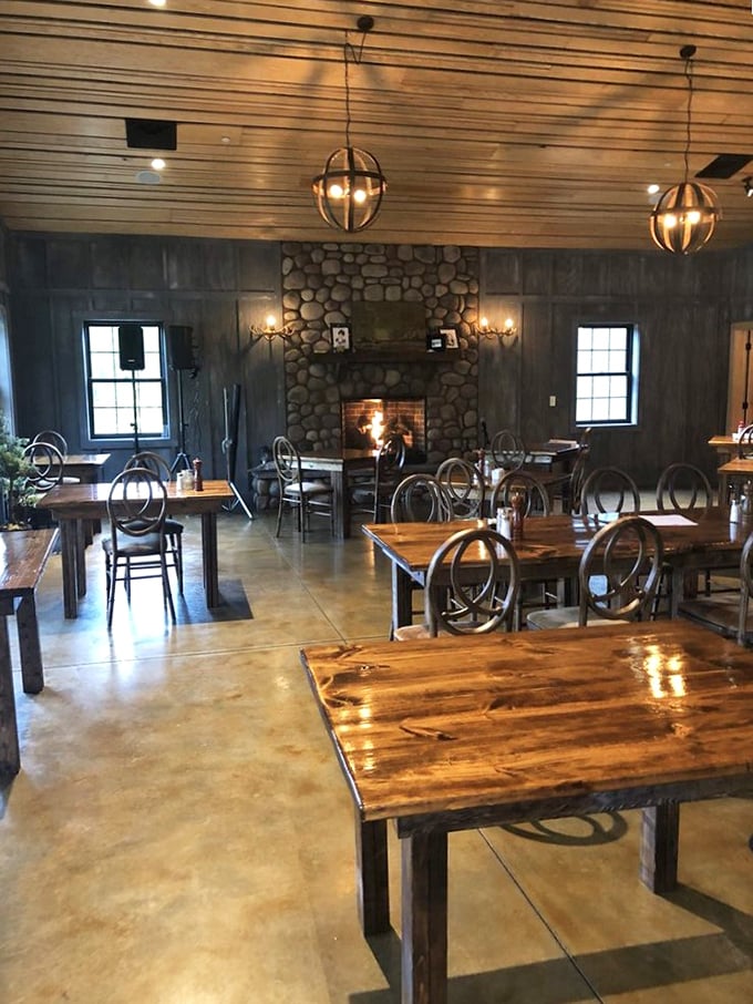 A stone fireplace anchors the dining room, creating a space where conversations flow as freely as the wine. Rustic elegance at its finest.