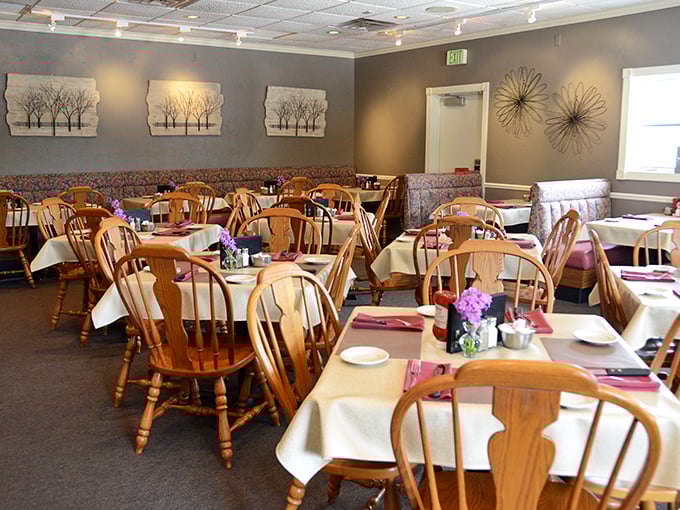 White tablecloths and Windsor chairs—the dining room whispers "special occasion" even when your only celebration is Tuesday.