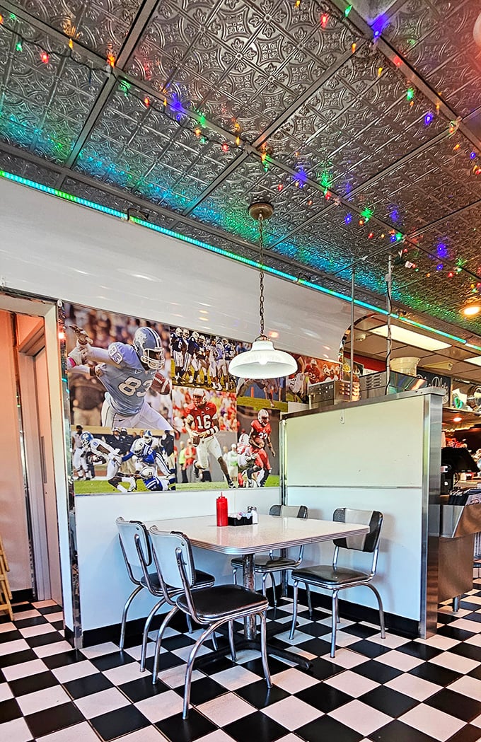 Sports memorabilia watches over diners like friendly ghosts of games past, while the pressed tin ceiling adds vintage charm.
