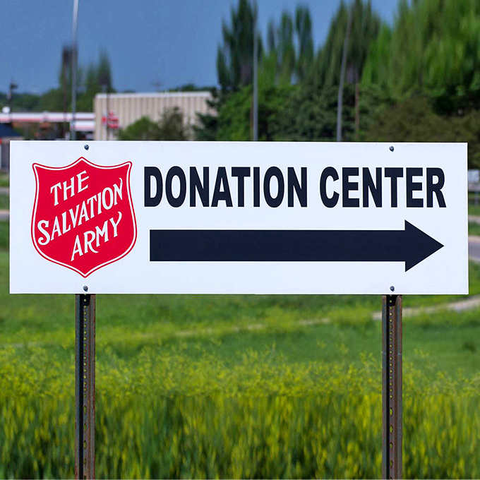 This directional sign points the way to where your gently-used donations transform into community support and second chances.