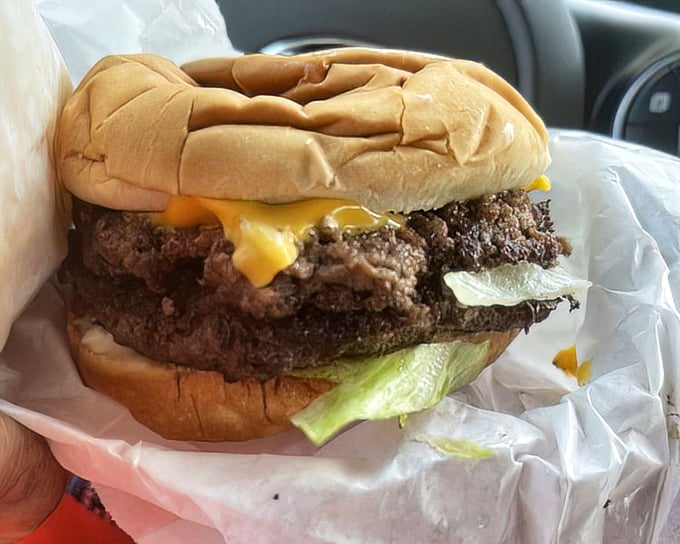 This double cheeseburger doesn't need filters or fancy lighting—it's confident in its juicy, cheese-draped magnificence.