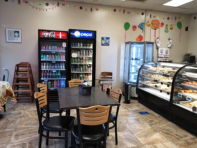 The drink station and seating area create that perfect "stay awhile" vibe – because good pastry deserves to be savored, not rushed.