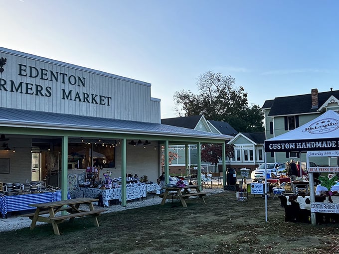 The Edenton Farmers Market brings local flavor to life with its simple white building and inviting picnic tables – a gathering place for community and commerce.