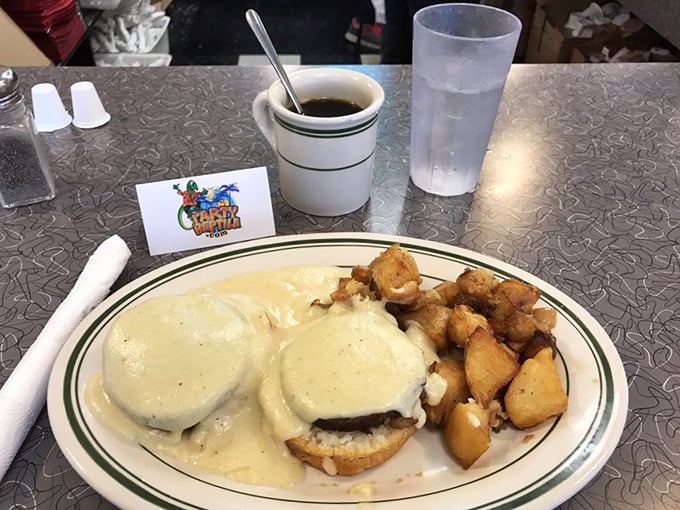 Eggs Benedict with a blanket of hollandaise and perfectly crisp potatoes – the breakfast that makes you want to high-five the chef and take a nap simultaneously.