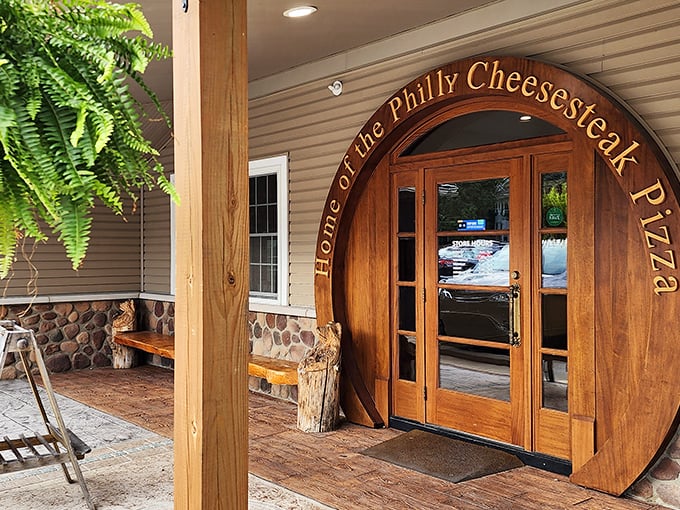 "Home of the Philly Cheesesteak Pizza" isn't just a slogan—it's a wooden archway inviting you into flavor paradise.