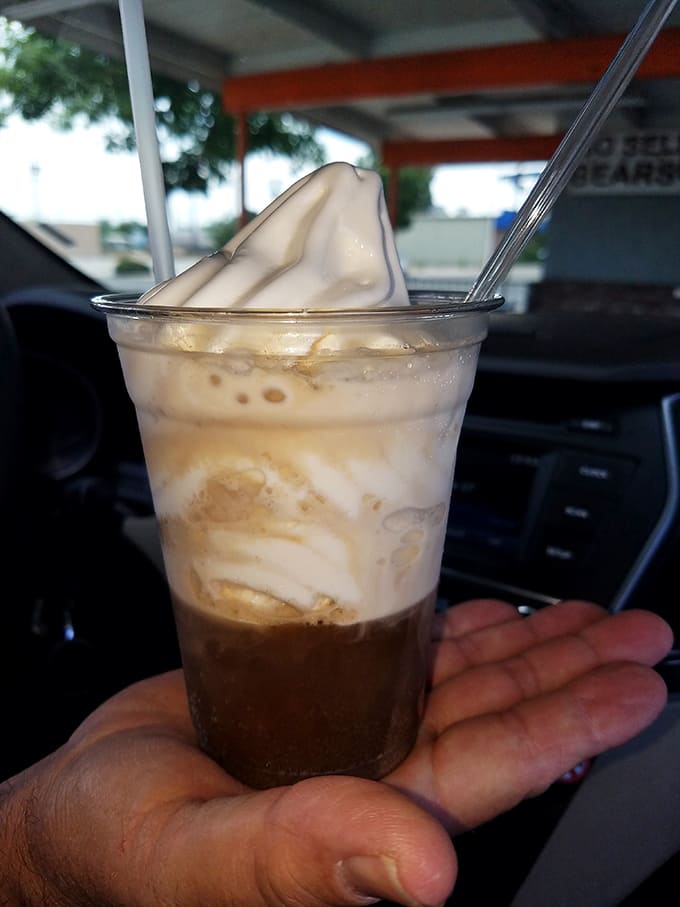 The root beer float arrives like a science experiment gone deliciously right—creamy vanilla ice cream slowly surrendering to carbonated bliss.