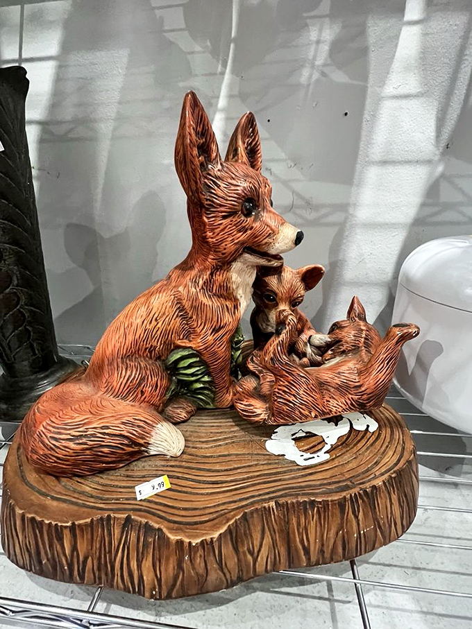 This fox family figurine perfectly captures thrift store magic—someone's discarded knickknack becomes another's conversation piece and mantel treasure.