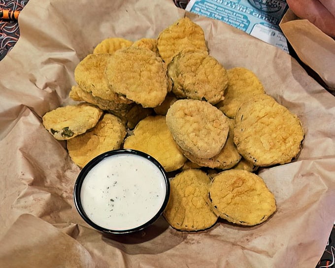 These golden fried pickles aren't just appetizers—they're crunchy little discs of joy served with a side of nostalgia.