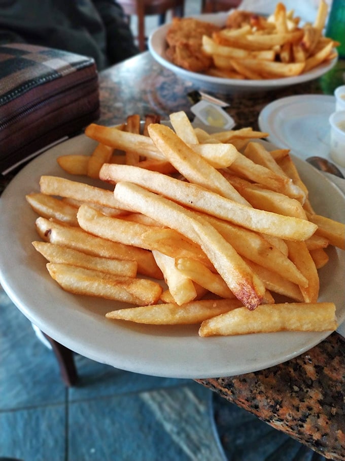 French fries so perfectly golden they deserve their own Florida sunshine metaphor. Crispy outside, fluffy inside – nature's perfect design.