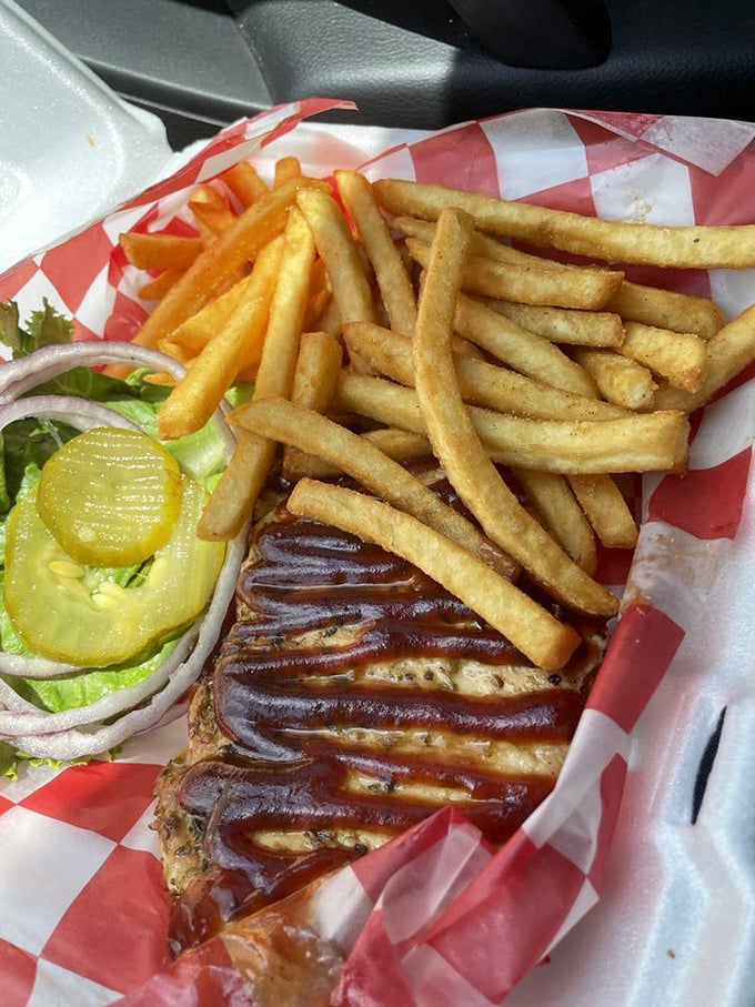 Golden fries that achieve the perfect crisp-to-fluffy ratio, served alongside a sandwich slathered in sauce that demands extra napkins.