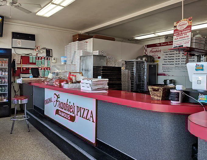 The counter hasn't changed much over the decades – why mess with perfection when you've mastered the art of Miami pizza?