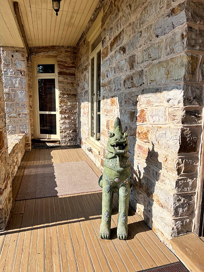 Even the castle's porch has guardians—this stone sentinel has been keeping watch since long before Ring doorbells were invented.