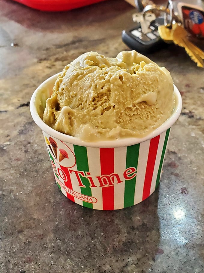 Italian gelato in its natural habitat—a striped cup that signals to your brain that yes, there is indeed room for dessert after all that pizza.