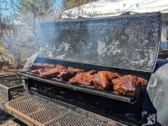 The smoker—where the magic happens. Those hunks of meat are transforming into the stuff of local legend.