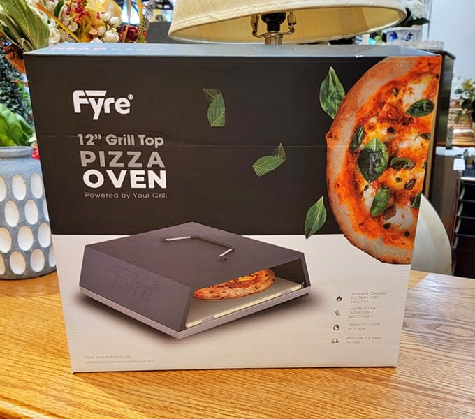 A pizza oven that promises to transform your backyard grilling game from "pretty good" to "why do we ever order delivery?"