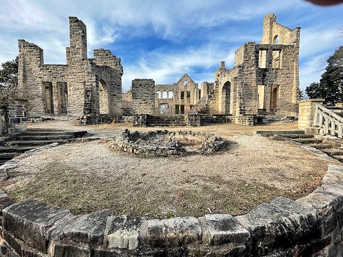 Inside the castle ruins, where dreams of Midwest royalty met Missouri reality. The stone walls frame perfect portraits of what might have been.