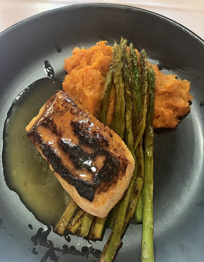 Halibut that's dressed for success with a perfect sear, resting on a bed of sweet potato purée. Even the asparagus looks like it's having a good day.