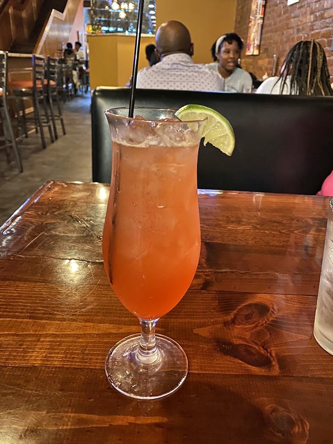 A cocktail garnished with lime that says, "Yes, you deserve this little vacation in a glass after navigating Pittsburgh traffic to get here."