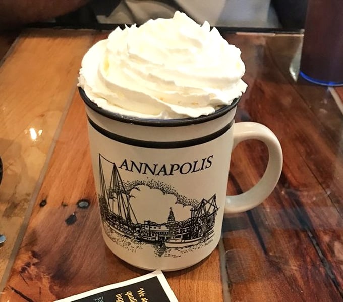 Whipped cream mountain atop steaming hot chocolate—the kind of drink that makes you wonder why anyone ever invented plain coffee. 