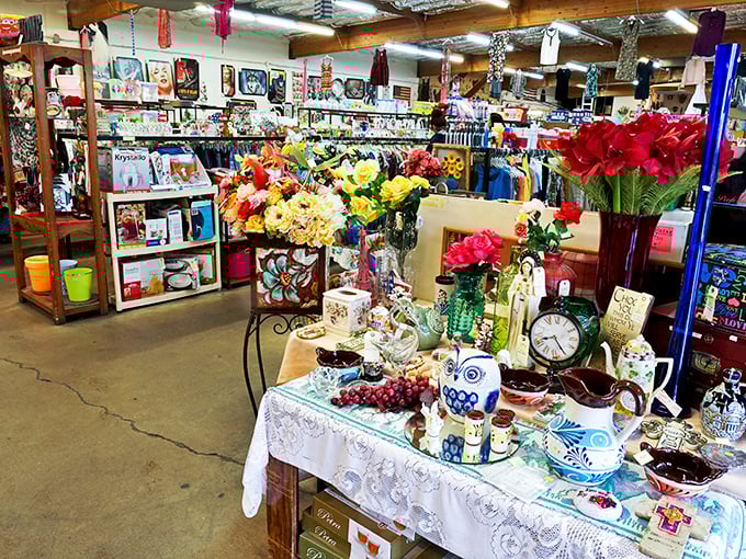 A carefully arranged display of home décor and artificial flowers—proof that someone's discarded tchotchkes can become your mantelpiece masterpieces.