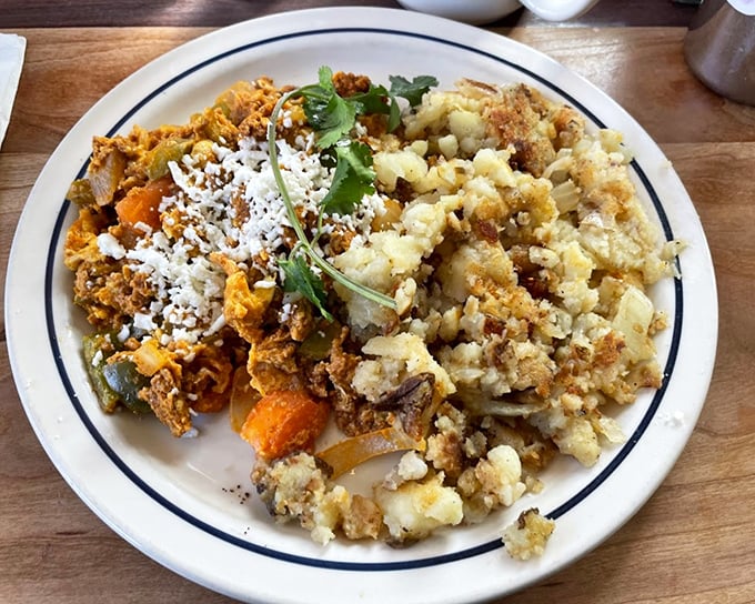 A fiesta on a plate – spiced chorizo and potatoes dancing with fresh cilantro under a perfectly cooked egg sombrero.