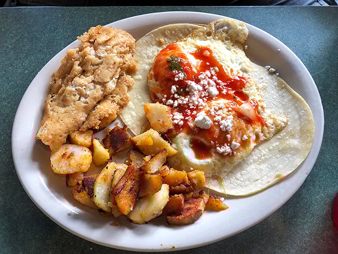 Huevos rancheros with a side of perfectly seasoned home fries—a breakfast fiesta that makes Monday morning feel like Saturday.
