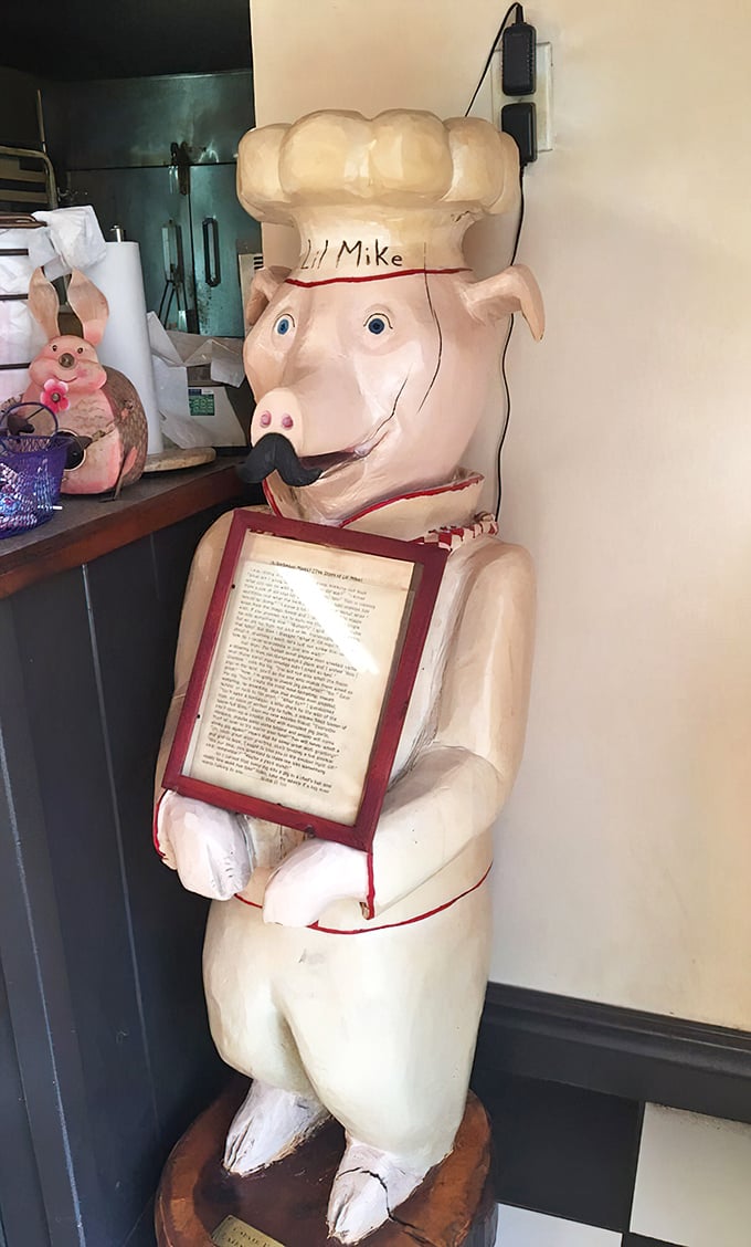 Meet the unofficial mascot: a pig statue that serves as both greeter and reminder of the delicious sacrifices made for your meal.