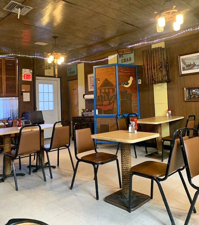Wood-paneled walls, simple tables, and nautical touches create the perfect backdrop for seafood feasting—no distractions from the main event.