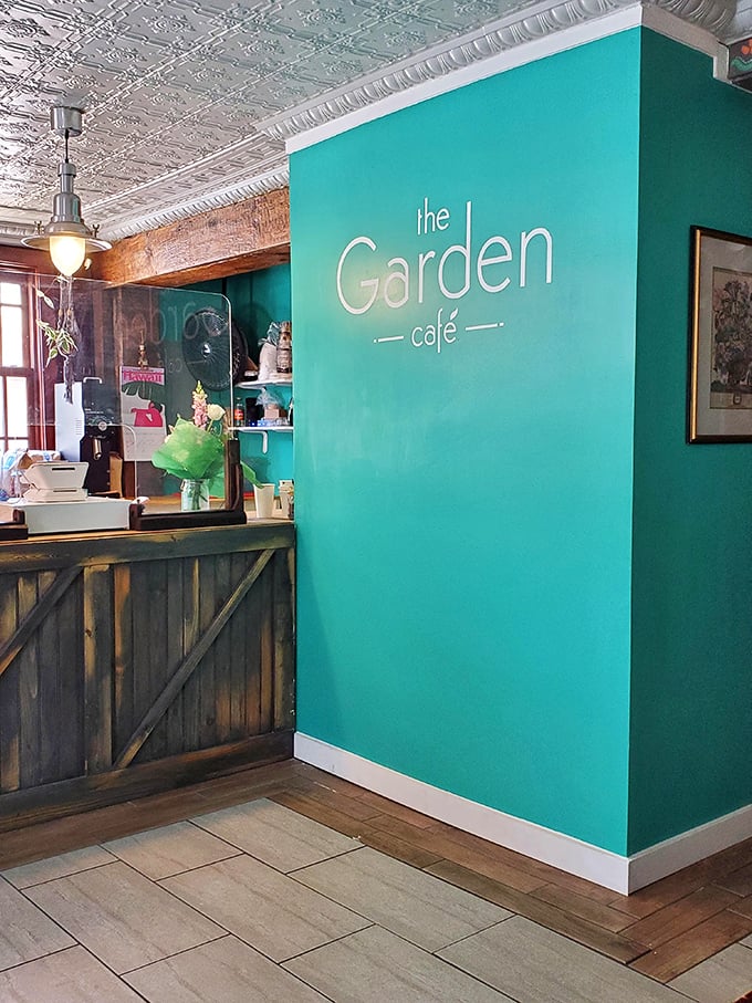 The Garden Cafe's vibrant interior sign welcomes you into their world of culinary magic.