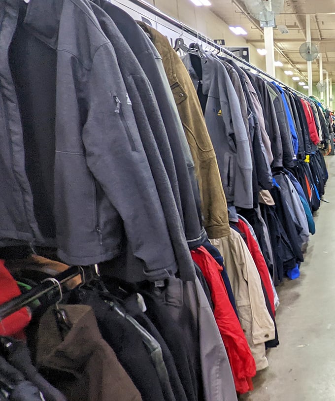 Men's jackets lined up like soldiers ready for deployment to new closets. That perfect leather bomber is hiding somewhere in this battalion.