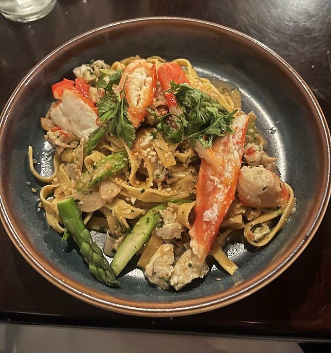Pasta that doesn't just carry seafood—it celebrates it, with tender crab, fresh asparagus, and enough flavor to transport you to coastal France.