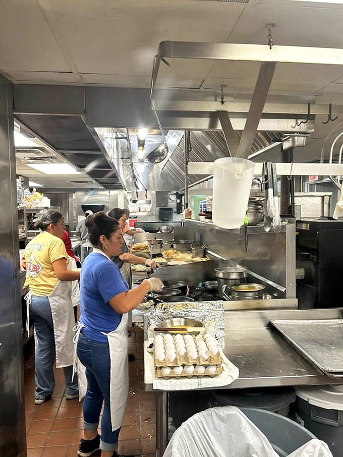 The kitchen ballet—where short-order magic happens. Those hands have flipped more pancakes than most of us have had hot breakfasts.