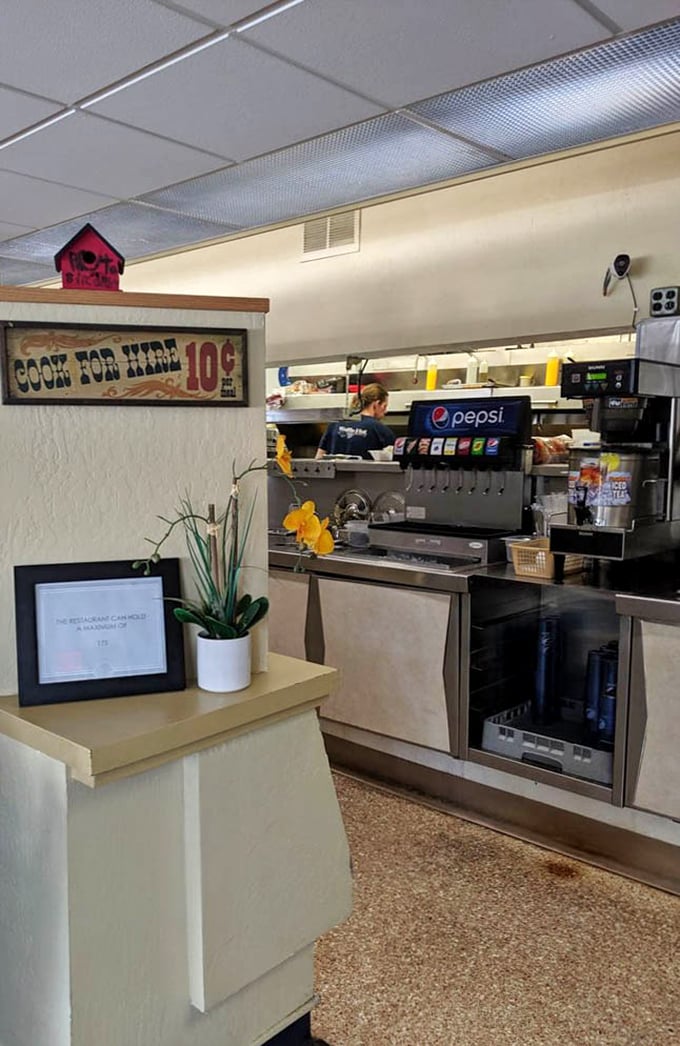 That "Cook For Hire 10¢" sign tells you everything about the playful spirit behind this serious food operation.