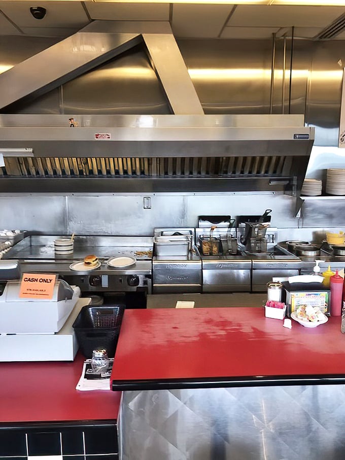 The beating heart of the operation—stainless steel, sizzling heat, and the promise of good things to come.