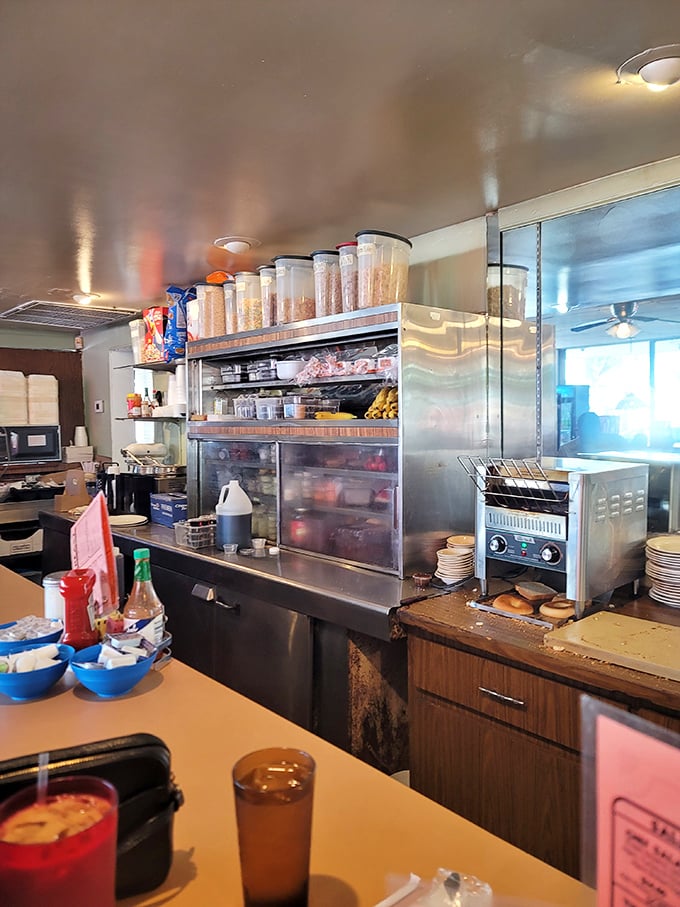 The kitchen—where breakfast magic happens amid stainless steel and decades of cooking wisdom, with no fancy gadgets required.