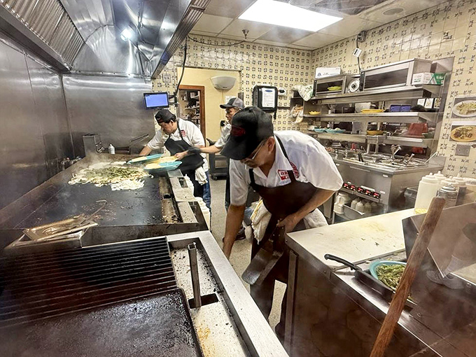 Where the magic happens—skilled hands transforming simple ingredients into the dishes that have kept Austinites coming back since Eisenhower was president.