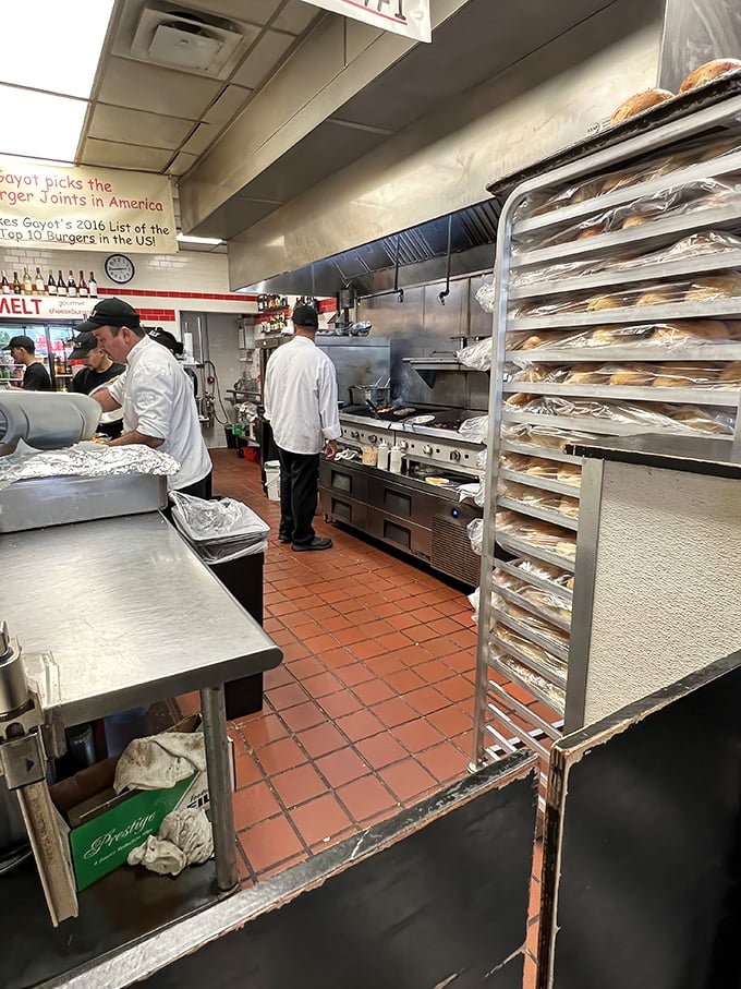 The kitchen ballet – where burger dreams become reality. Those fresh buns waiting patiently for their moment to shine.