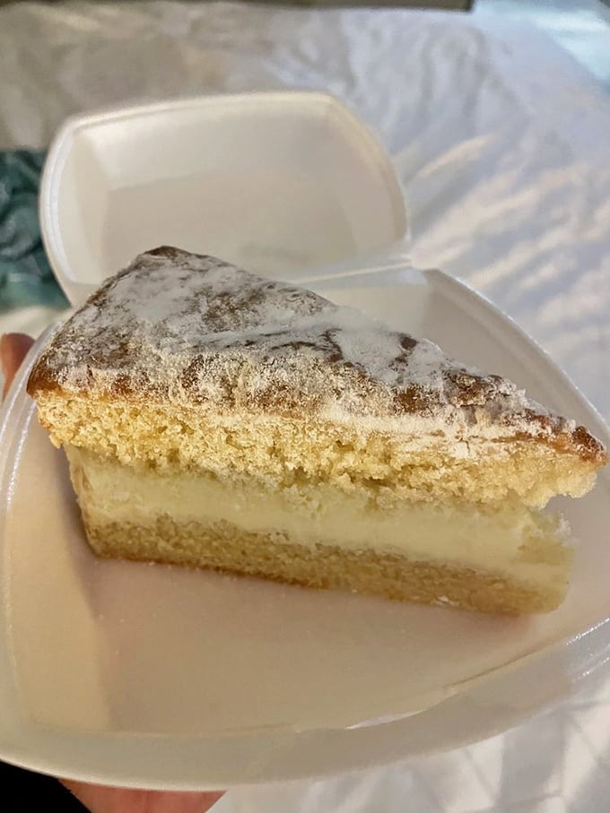 This lemon cream cake doesn't just end your meal – it provides closure, therapy, and a compelling reason to skip your diet.