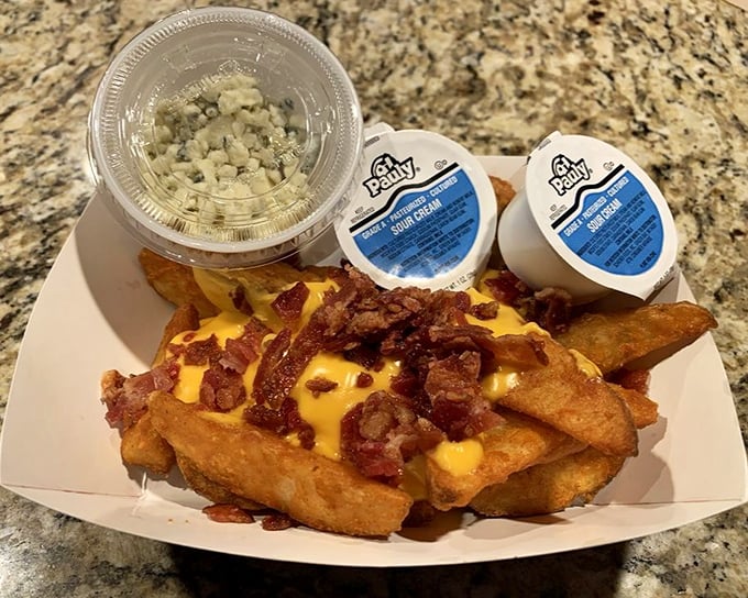 Loaded potato wedges topped with cheese and bacon—because sometimes fries need to dress up for special occasions.