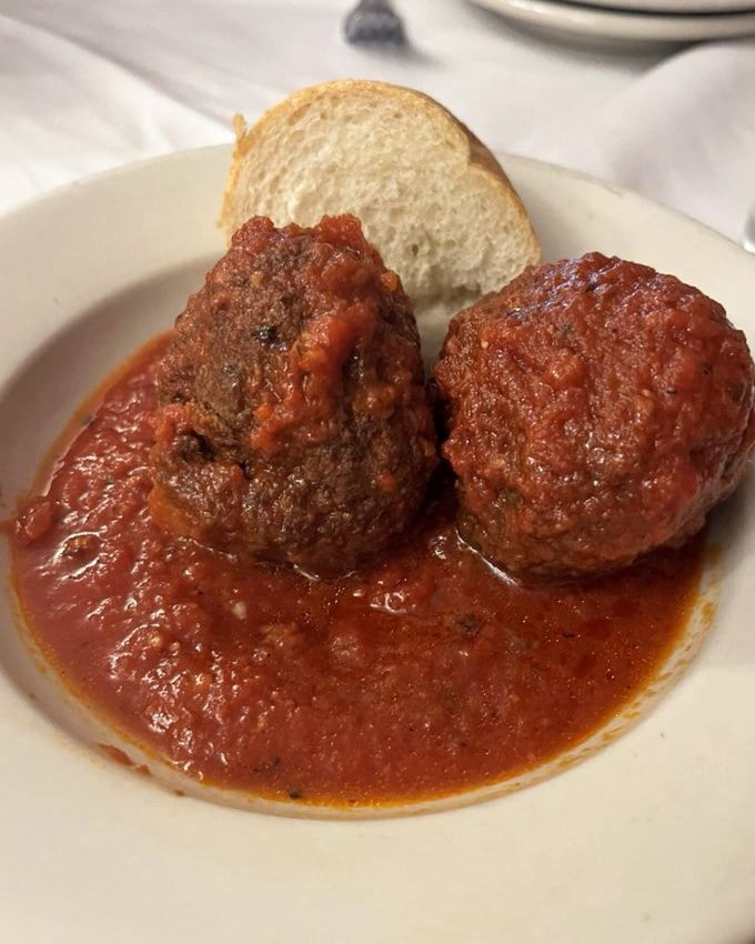 Meatballs that deserve their own area code—tender, savory planets orbiting in a sea of that famous red sauce. The bread is non-negotiable.