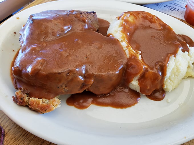 Meatloaf and mashed potatoes swimming in gravy—the kind of plate that makes you want to hug whoever's in the kitchen.